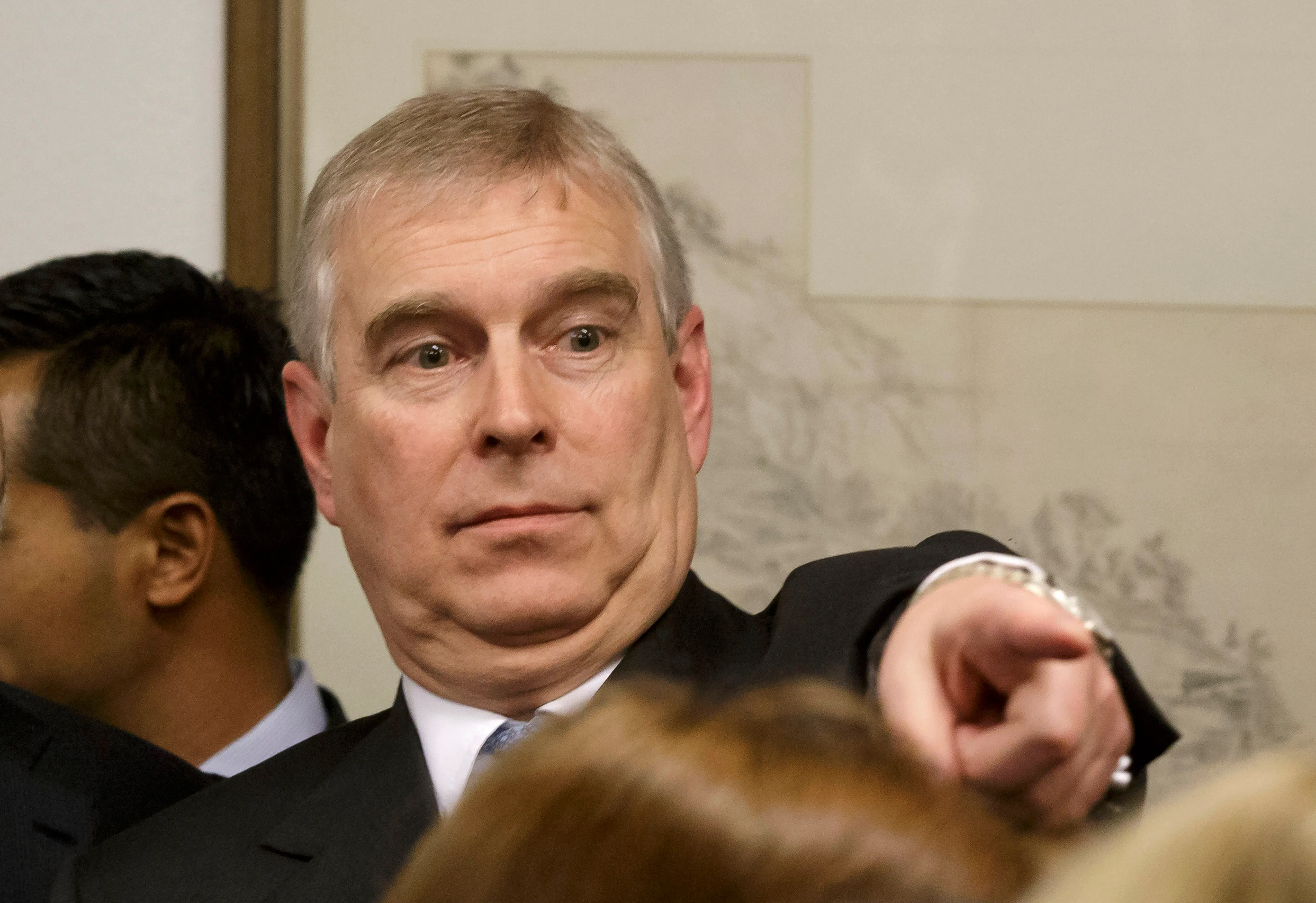 Former Prince Andrew reportedly pictured crouched over woman in newly ...