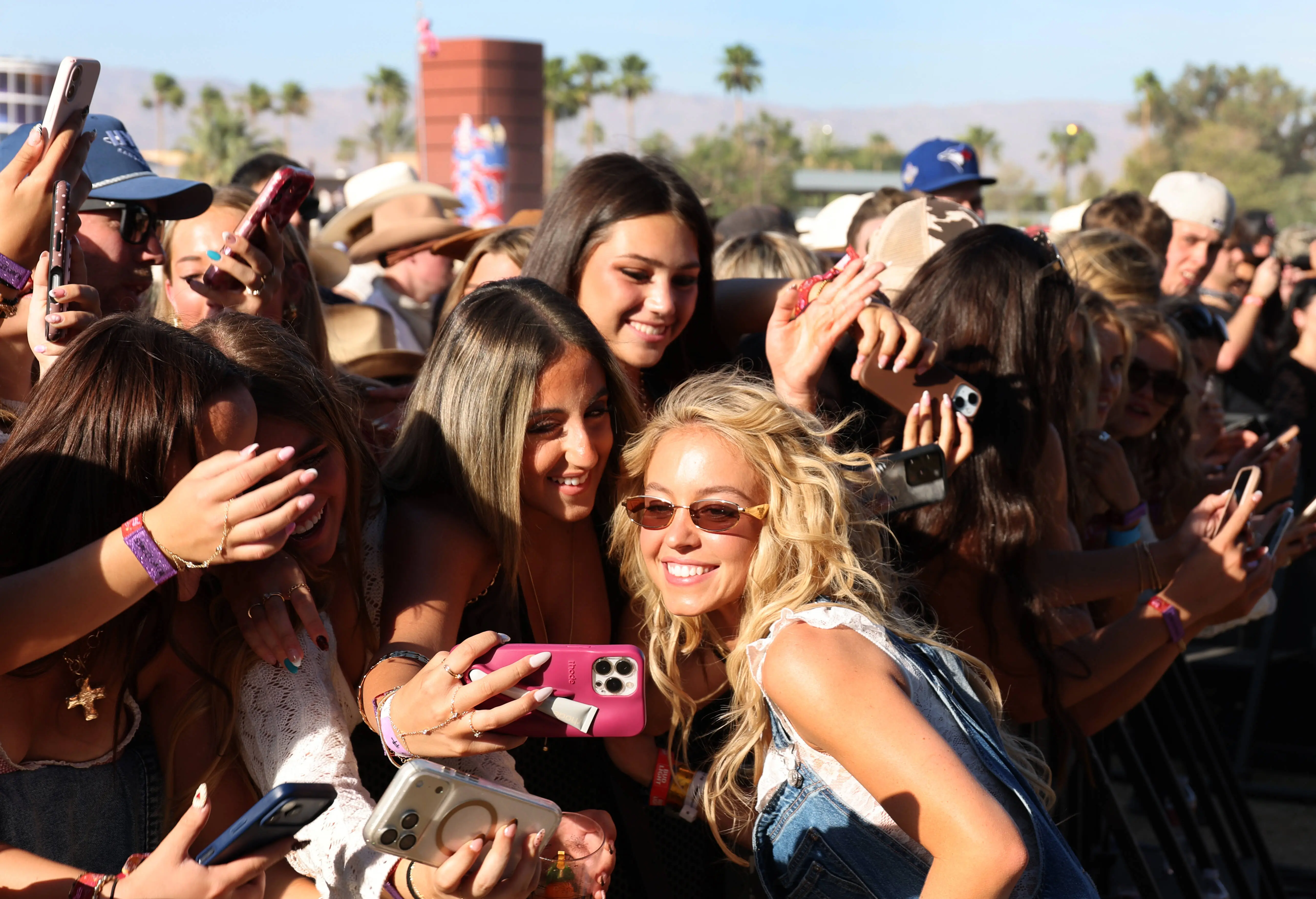 Sydney Sweeney rides on Scooter Braun’s shoulders at Stagecoach bobbing ...